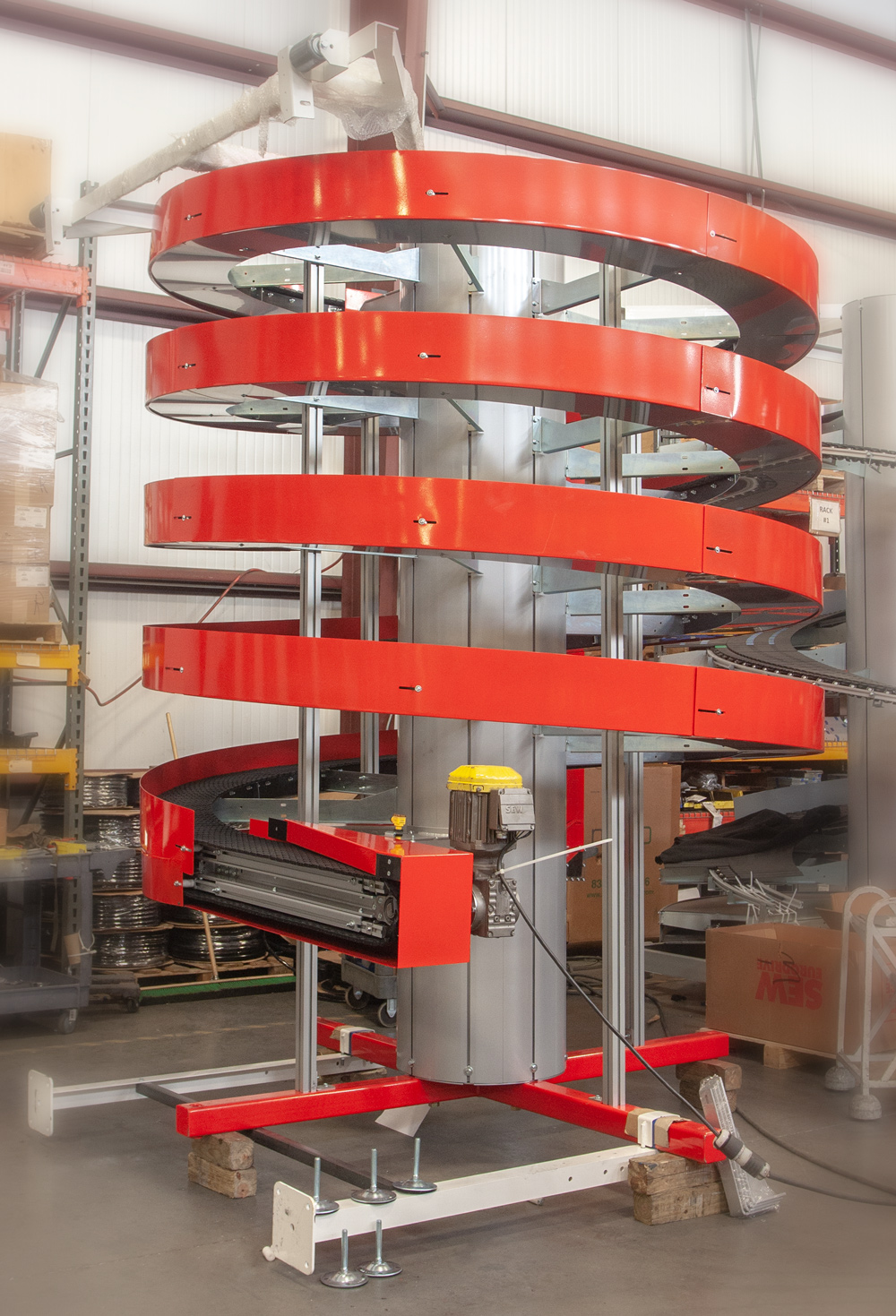 Spiral Lowerator to Side Transfer Empty Glass Bottles at a Beverage Plant